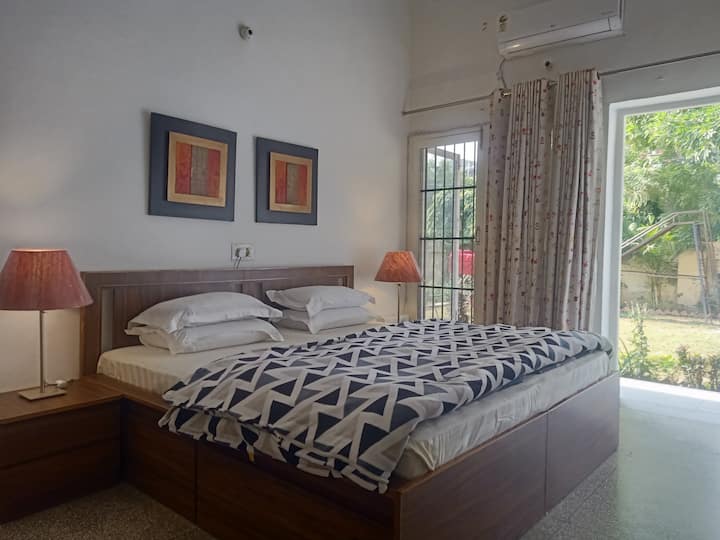 Cozy Room Opening Into Serene Garden - Punjab