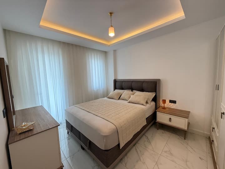 Семейный комфорт в 1+1, 
новый дом в центре Алании - Alanya