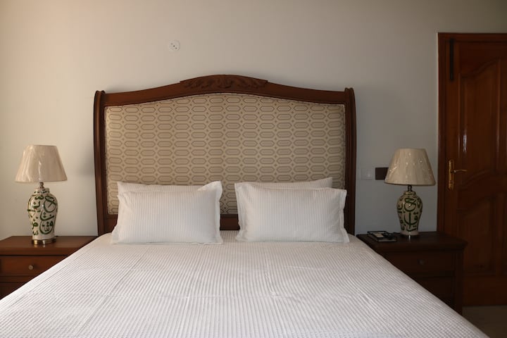 Lawrence Home | Deluxe King Room & Private Balcony - Lahore