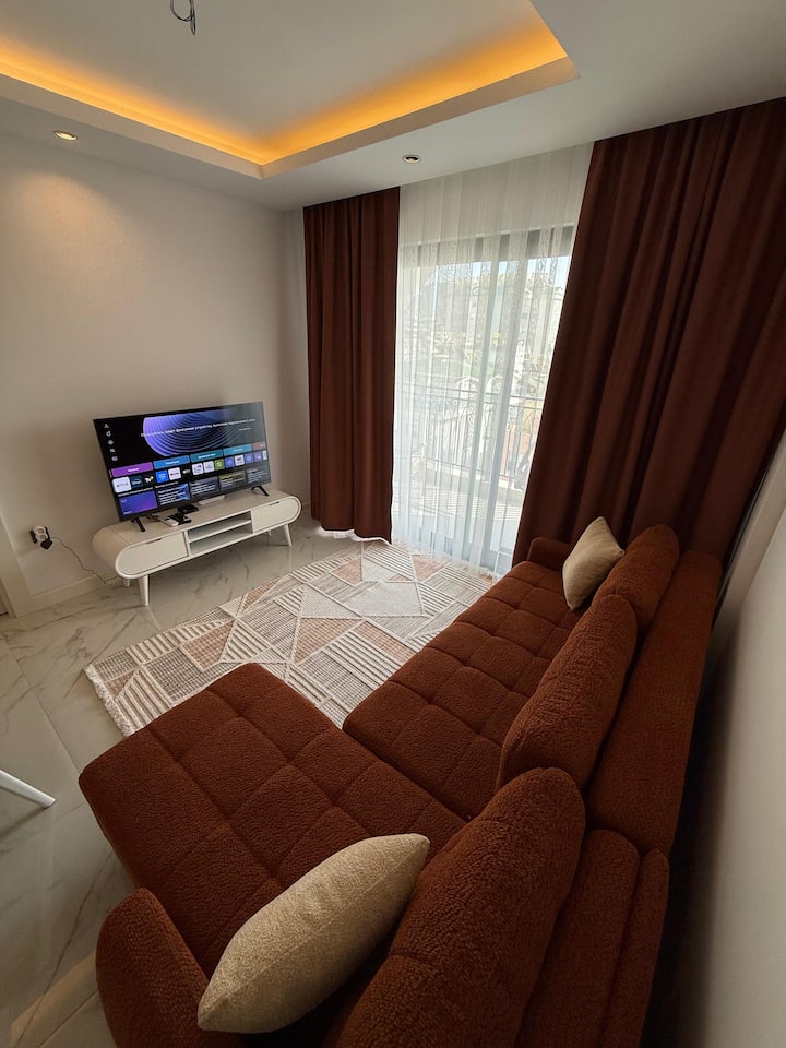 Новая 1+1 в отельном и свежем доме
 5 звёзд - Alanya