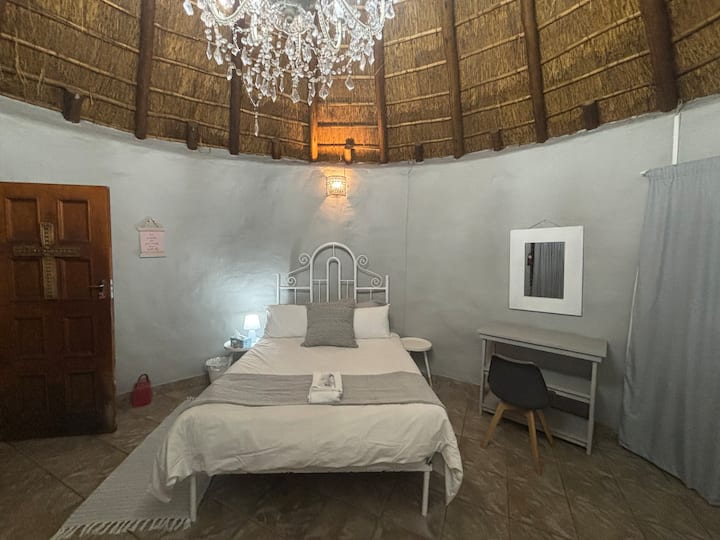 Irene Stonewall Rondawel Under The Jacaranda Tree - Centurion