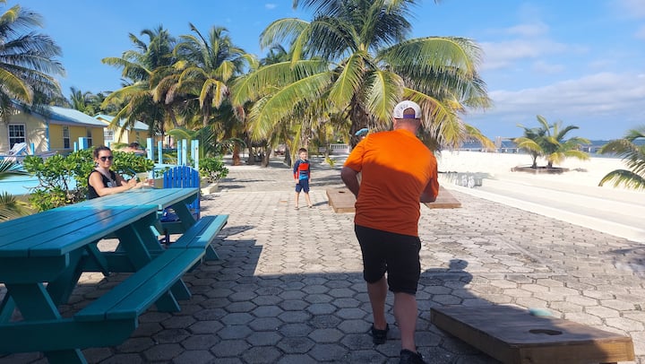 Parents And Kid By The Sea - Belize