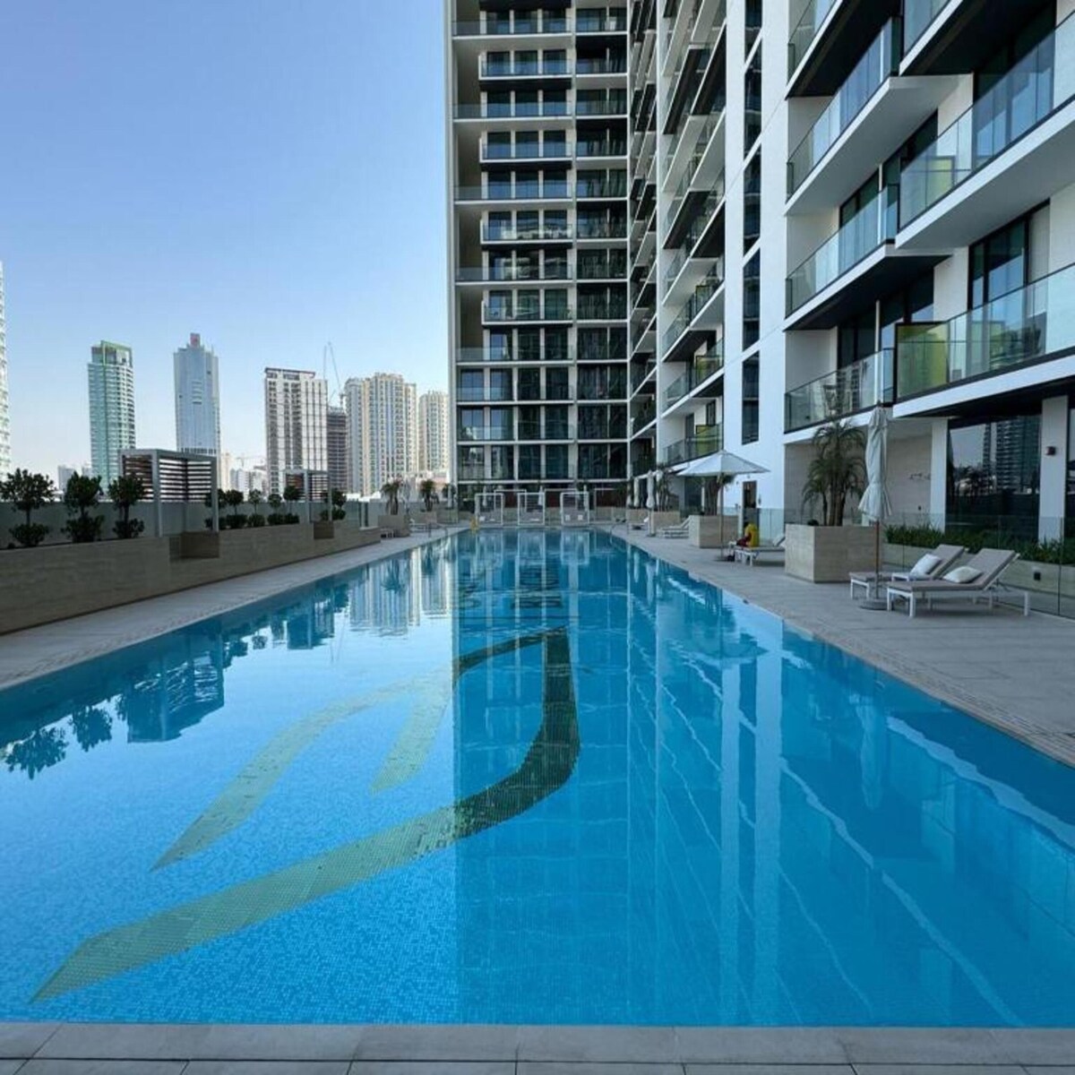 Luxury Living 1BR in JVC | Pool, Gym & BBQ Access - Serviced apartments ...
