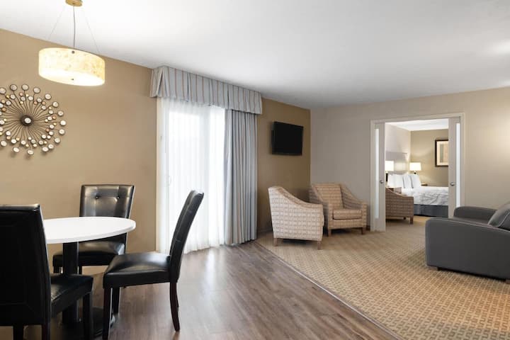 1br King Lux | Eastland Suites | Kitchen + Living - Bloomington, IL