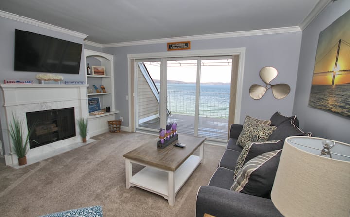 Vaulted Ceilings + Prime Lake Charlevoix Views | Fireplace | Private Patio| - Michigan